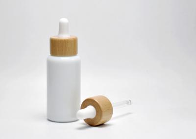 China Jade Porcelain White 40ml Boston Round Opal Glass Bottle With Wooden Dropper Cap For Face Oil, Facial Serum, Beauty Oil for sale