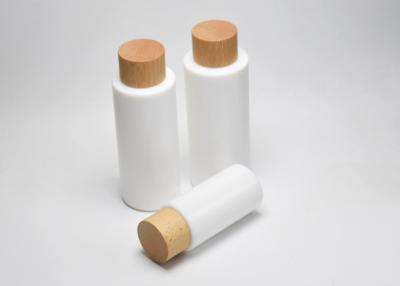 China BG-194Q-J, 40, 100, 120ml opaque white glass lotion bottle with wooden screw cap, luxury glass cosmeceutical packaging for sale