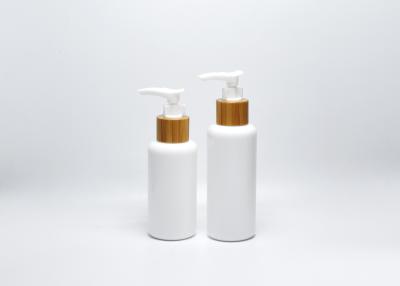 China 3.3OZ 4OZ boston round opal white glass bottles with real bamboo-plastic lotion pump, skincare packaging wholesale for sale