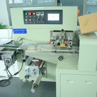China Down-walking paper bag conveyor belt horizontal packaging machine customized mask daily necessities food film packaging for sale