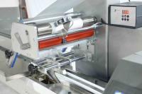 China tableware honey spoon pillow packaging machine horizontal face mask biscuit bakery bread flow pack packaging machine for sale