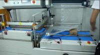 China Automatic bottle shrink wrap packing machine PVC Film Heat Tunnel Shrink Wrapping Machine for water bottles aluminum cans for sale