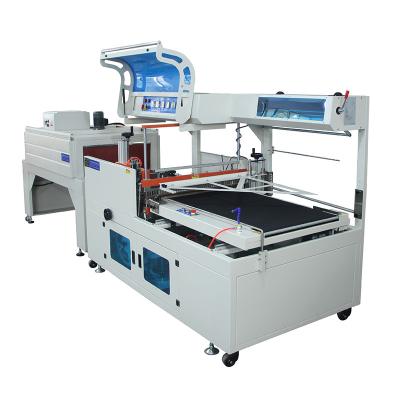 China Hot Sales Heat Shrinking Wrapping Equipment Over Wrapper Iron Part Toys Hardware Shrinking Packaging Machine for sale