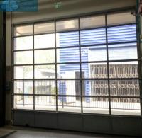China 220V 2.5mm Galvanized Steel PC Glass Panel Garage Doors for sale
