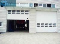 China Thermal Insulated AC220V 150mm Track Overhead Garage Door for sale