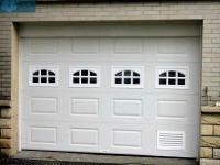 China PU Infilled Insulated Galvanized Steel Panel Sectional Overhead Door for sale