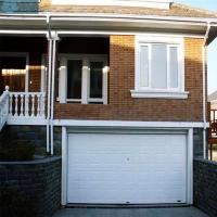 China PU Foaming Galvanized Steel Overhead Garage Door IP55 With Windows for sale