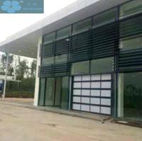 China Organic Glass Panel Aluminium Alloy Frame Sectional Overhead Door for sale