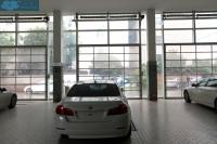 China UV Proof Residential Tempered Glass Sectional Overhead Garage Door for sale