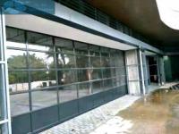 China UV Proof Residential Tempered Glass Sectional Overhead Garage Door for sale