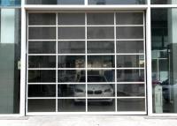 China Aluminum Frame Transparent Glass Panel Sectional Garage Doors for sale