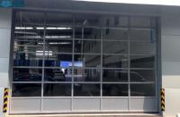 China Aluminum Frame Transparent Glass Panel Sectional Garage Doors for sale