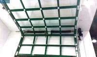 China Aluminum Frame Transparent Glass Panel Sectional Garage Doors for sale