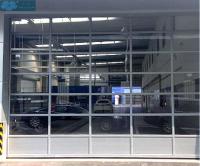 China Remote Control Aluminum Alloy Glass Sectional Garage Door for sale
