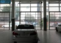 China Remote Control Aluminum Alloy Glass Sectional Garage Door for sale