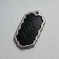 China Trendy men's pendant with a unique wavy metal edge,the black surface is decorated with geometric symbols,and it has an outstanding texture,adding personality and charm to your outfit. for sale