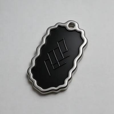 China Trendy men's pendant with a unique wavy metal edge,the black surface is decorated with geometric symbols,and it has an outstanding texture,adding personality and charm to your outfit. for sale