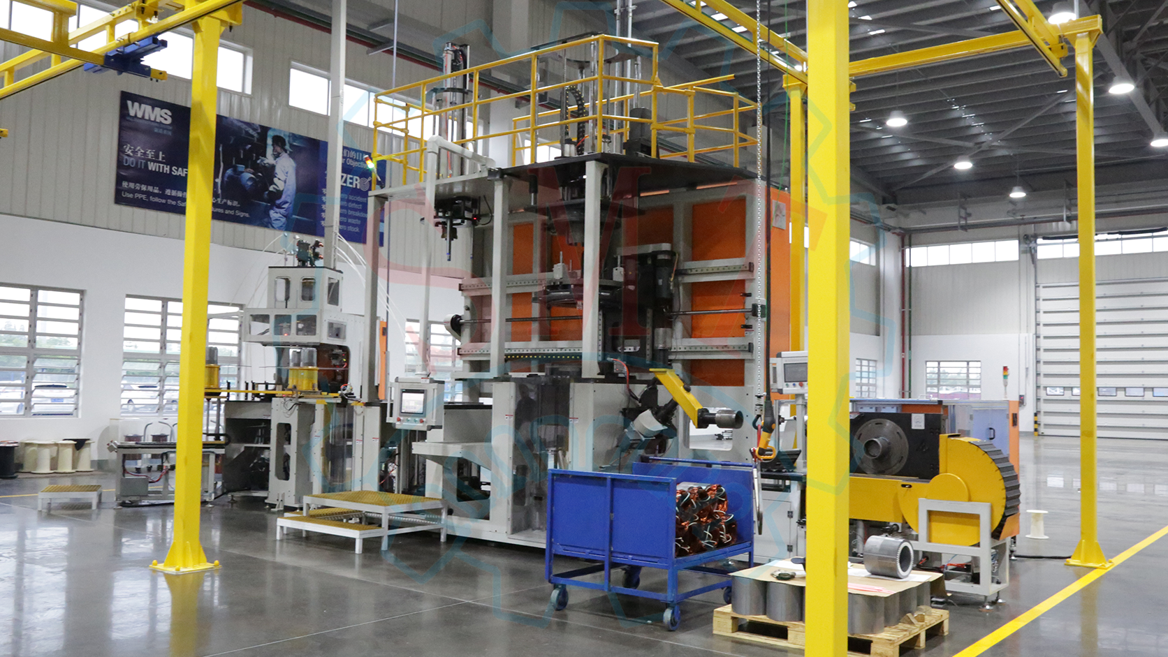 Automated small-motor stator line beside a flexible large industrial motor manufacturing cell