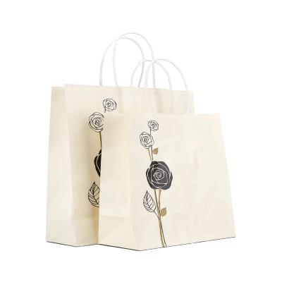 China Disposable Twisted Handle Paper Bags Eco Friendly Recycled Paper Gift Bags for sale