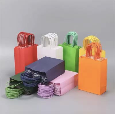 China Multi colored minimalist design with twisted kraft paper handle, recyclable shopping paper bag, printed with custom logo for sale