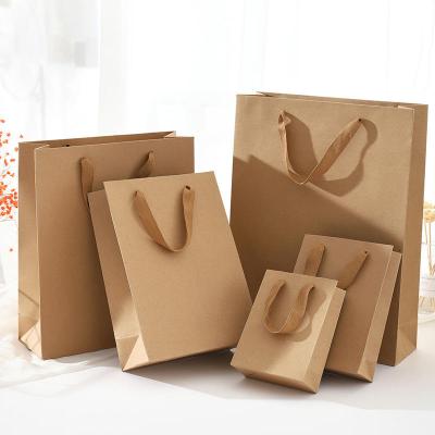 China Large Kraft Paper Bag Handbag Custom Printed Logo Packaging Clothing Paper Gift Bag for sale
