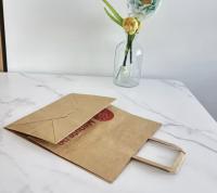 China Customized printed kraft paper takeaway bag with flat paper handle logo printed brown tote bag, suitable for coffee shops and bakeries for sale