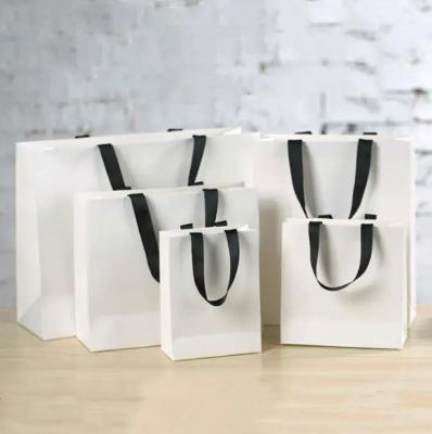 China Customizable Pink Kraft Paper Bag Carton Packaging Luxury Style Custom Logo Handles Jewelry Perfumes Crafts Christmas Gifts for sale