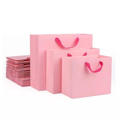 China Custom Brand Logo Luxury Paper Gift Bag Recyclable Gift Bags Handle Paper Packaging Bags Ribbon Handle for sale