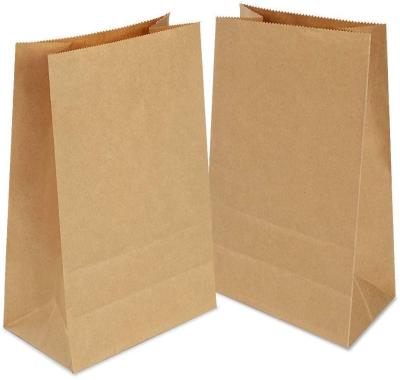 China Free Sample Custom Logo Printed Brown Kraft Paper Bag With Handles For Party Recycled Grocery Shopping Packaging for sale