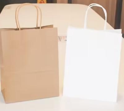 China Biodegradable white and brown kraft paper twisted handle shopping tote bag with custom logo offset printing and ribbon for sale