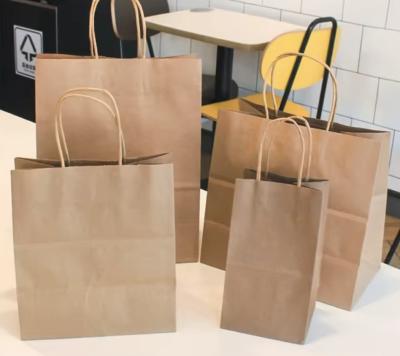 China Wholesale free samples, thick kraft paper bags with custom logo printing, high-quality shopping gift paper bags, twisted handle packaging bags for sale