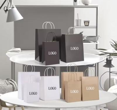 China Environmentally Friendly Reusable Brown Kraft Paper Luxury Tote Bag With Twisted Handle for sale