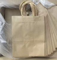 China Shopping tote bag with twisted handles made of white and brown kraft paper, printed with a logo for sale