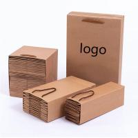 China Custom Logo Printing High Quality Kraft Paper Bag Wholesale Shopping Paper Bag Aluminum Foil Logo With Handle for sale