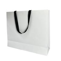 China Customize Shopping Bags Christmas Printed Paper Gift Bag with Bow Tie Ribbon Handle for sale