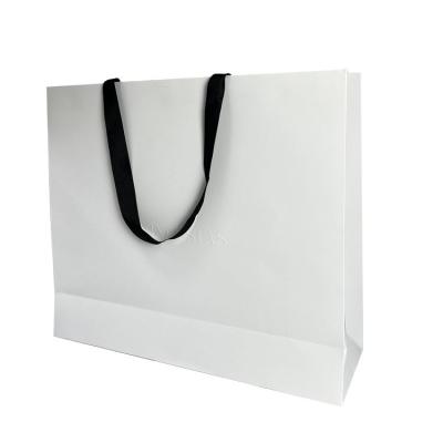 China Customize Shopping Bags Christmas Printed Paper Gift Bag with Bow Tie Ribbon Handle for sale