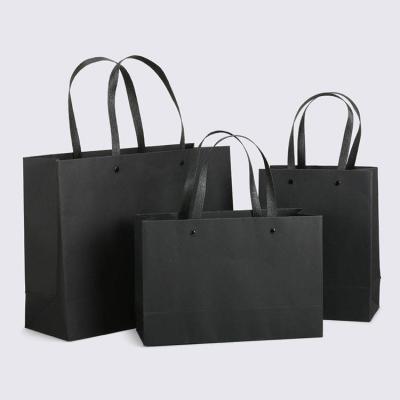 China Custom Printed Kraft Shopping Paper Bag With Handles Paper For Package for sale