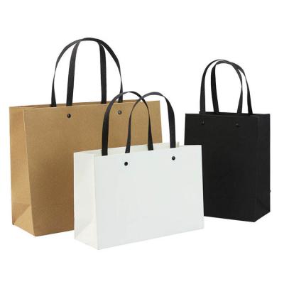 China Custom Printed Kraft Shopping Paper Bag With Handles Paper For Package for sale