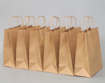 China Custom-sized, eco-friendly, recyclable kraft paper supermarket shopping bags with classic style T-shirt handles, laminated with your own logo for sale