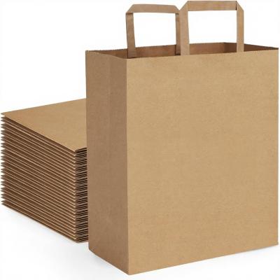 China Cheap Recycled Kraft Paper Carrier Bags With Flat Tape Handle Custom Printed Clothing Store Takeaway Shopping Bag Wholesale for sale