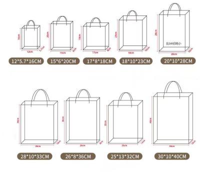 China Custom Logo Printed Recyclable Kraft Craft Paper Bags Flat Handles Take Food Packaging for sale