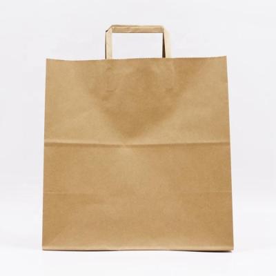 China Flat Fold Handle Durable Using Biodegradable Kraft Paper Packing Bags With Handle for sale