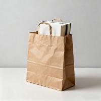China Environmentally Friendly Biodegradable Kraft Paper Shopping Bag Flat Handle Customized Logo Packaging for sale