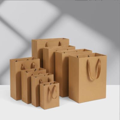 China Gift Paper Bag Custom Packaging Paper Bags Clothing Cardboard Shopping Kraft Carrier Bag for sale