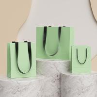 China Paper Tote Bag Shopper Paper Customized Kraft Paper Bag With Ribbon Handle Shipping Clothes Bags for sale