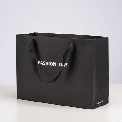 China Black Handmade Paper Gift Clothes And Bags Wrapping Creative Customised Embossed Texture Luxury Cardboard Paper Bag Logo Black for sale
