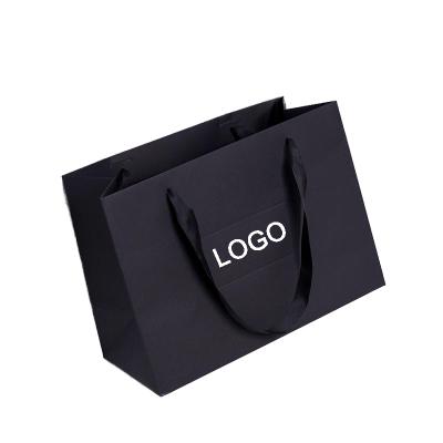 China Bulk Luxury Boutique Gift Paperboard Bags With Ribbon Handles Black And Gold Frame For Supermarket Packaging for sale