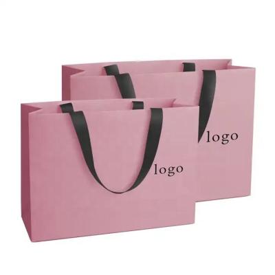 China White Cardboard Gift Customized Logo Garment Paper Bags For Clothes for sale
