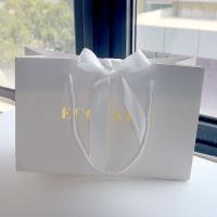 China Custom White Luxury Biodegradable Paper Gift Bag Handmade Ribbon Accessory For Small Businesses Supermarket Promotions for sale