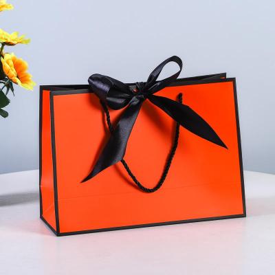China Custom Luxury Gift Shopping Paper Bag Handmade Design With Clothing Fur Handle Display Your Own Logo for sale